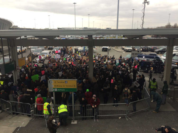Hundreds protest after 11 detained at JFK Airport amid immigration ...